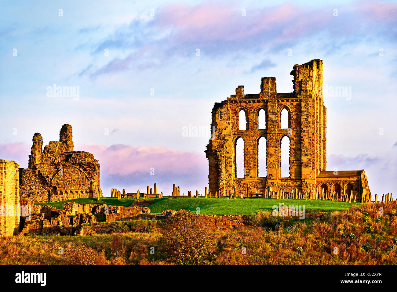 Tynemouth Priory and walls in a warm sunrise glow Stock Photo - Alamy