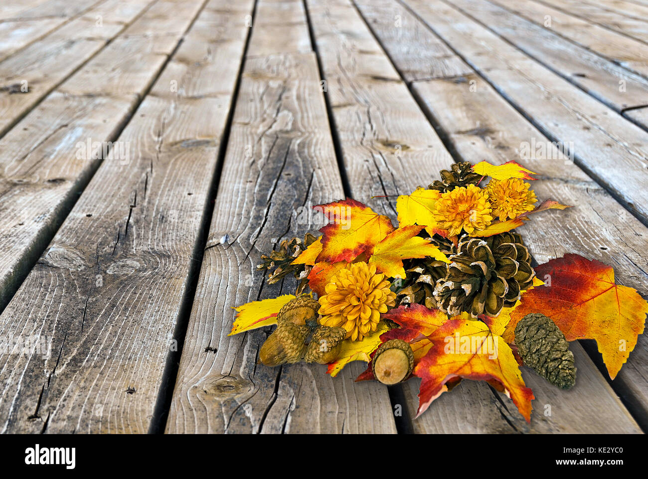 autumn leaves and pine cone bouquet on rustic wood Stock Photo - Alamy