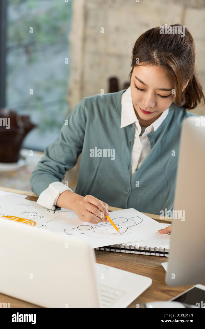 Portrait of young female car designer at work Stock Photo - Alamy