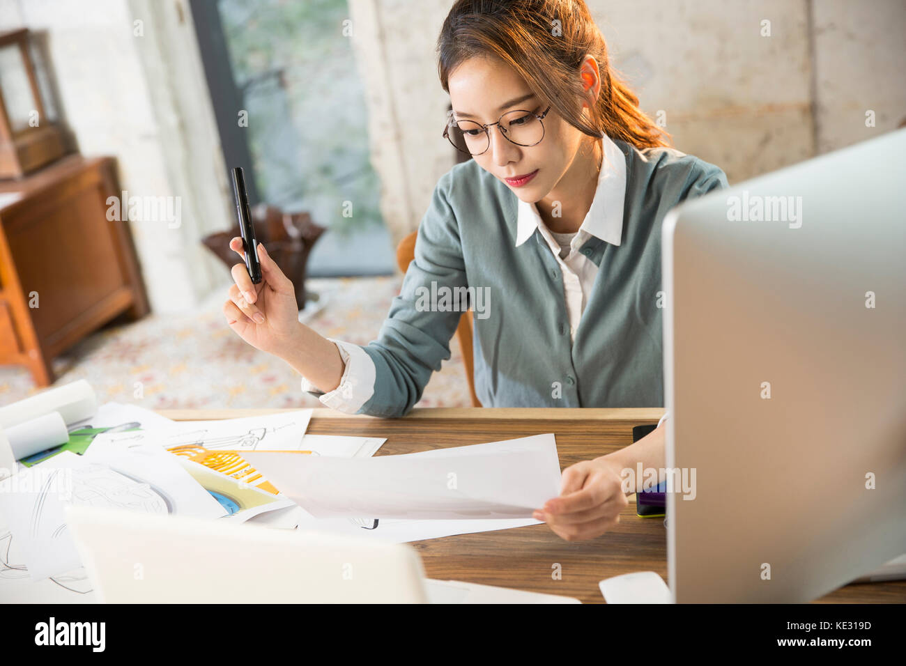 Portrait of young smiling female car designer at work Stock Photo - Alamy