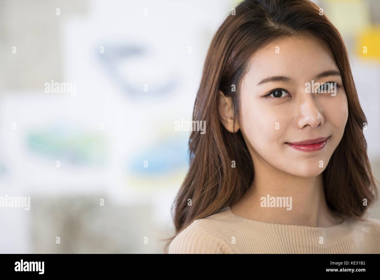 Portrait of young smiling female car designer Stock Photo - Alamy