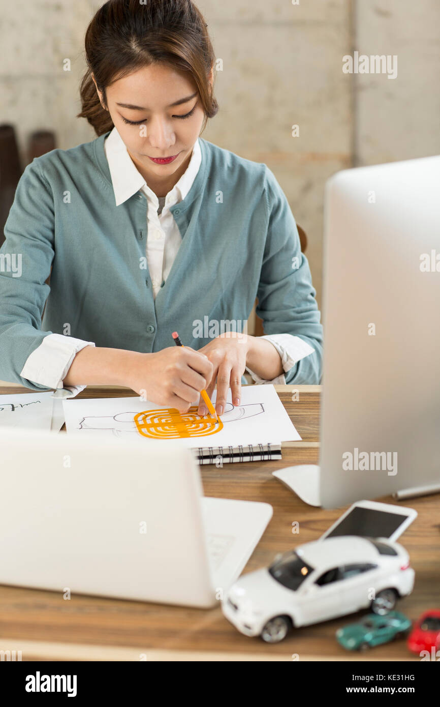 Portrait of young female car designer at work Stock Photo - Alamy