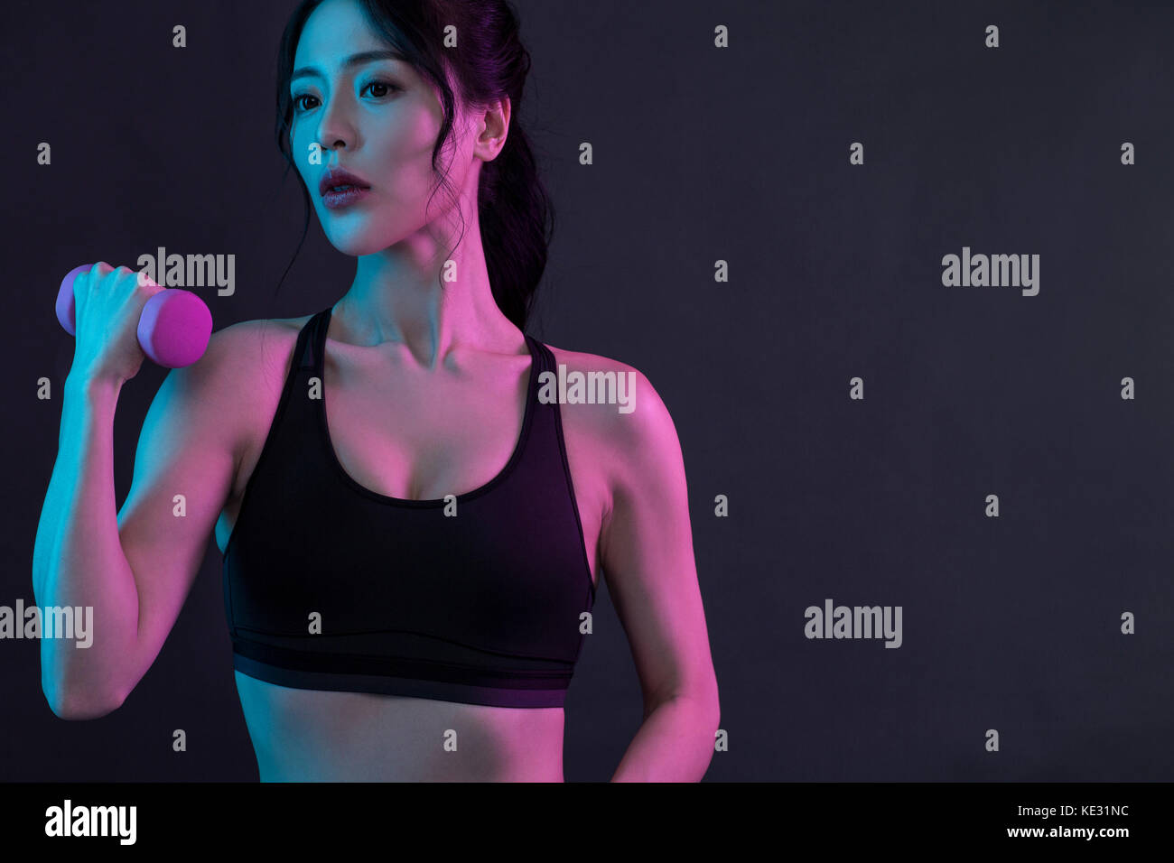 Strong woman lifting dumbbell workout hi-res stock photography and ...