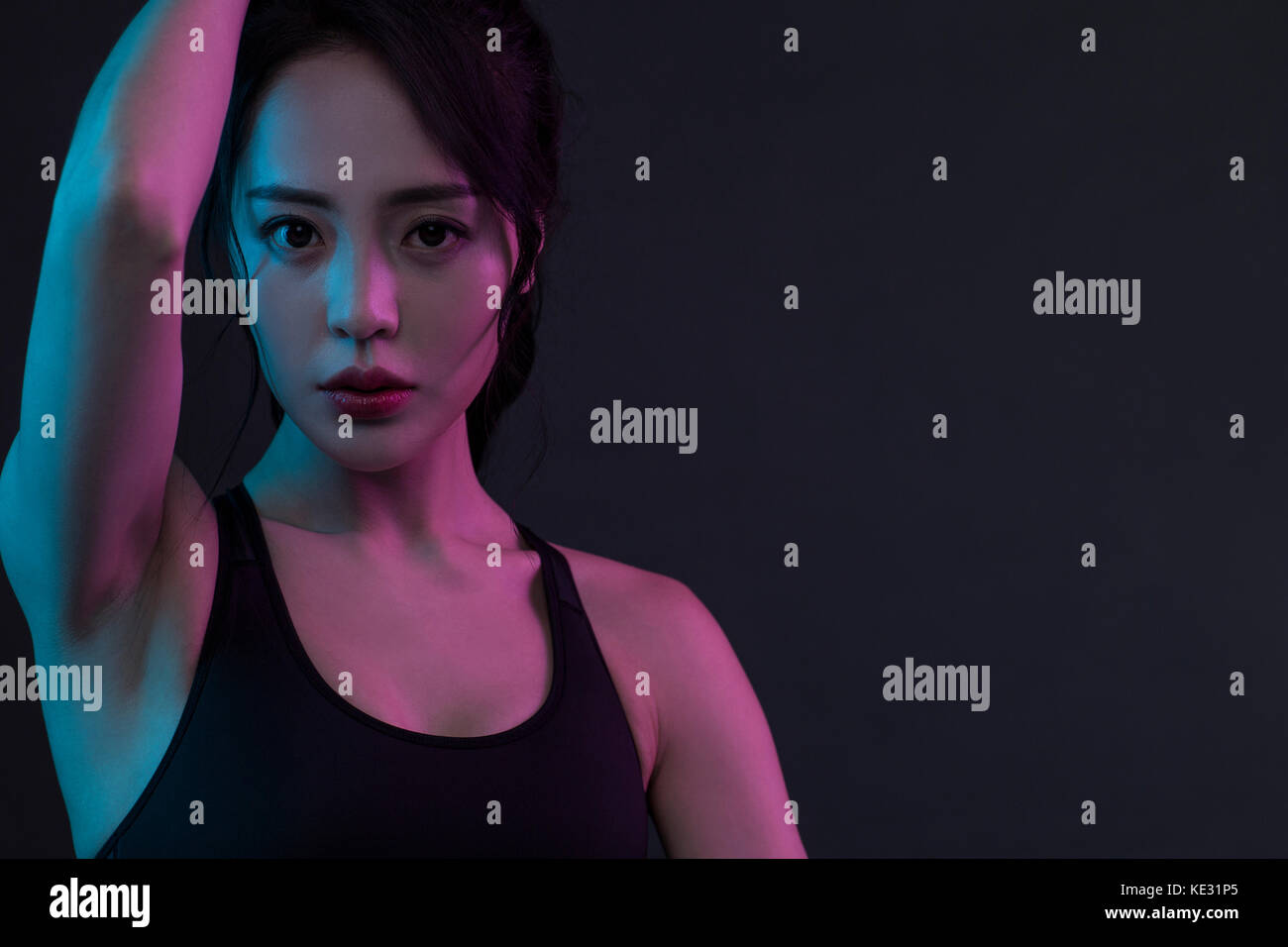 Portrait of young confident woman in sports bra Stock Photo - Alamy