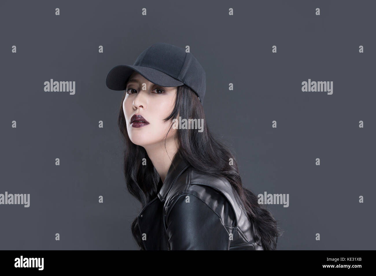 Woman in black leather jacket hi-res stock photography and images - Alamy