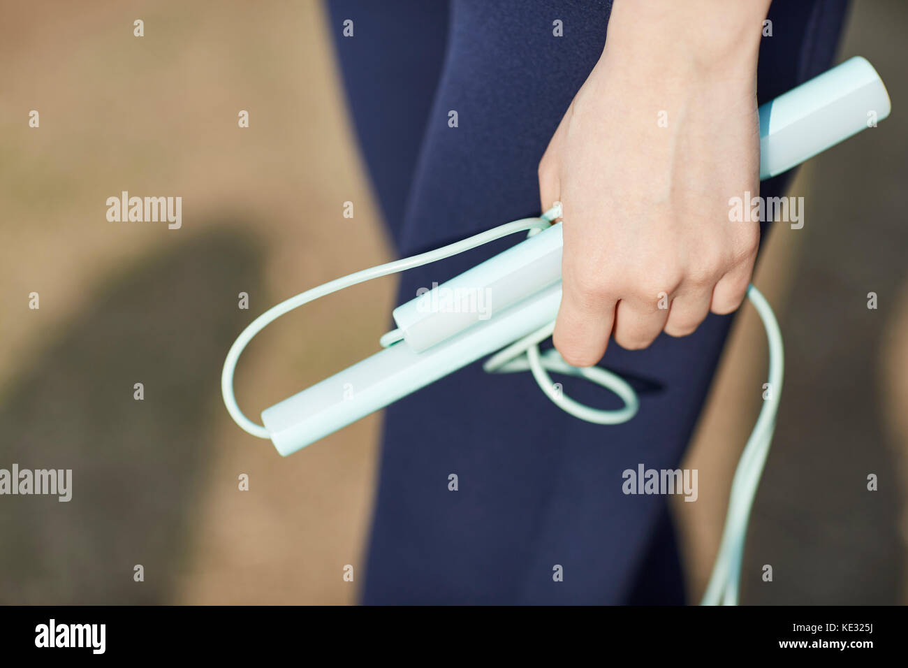Woman with jump rope Stock Photo - Alamy