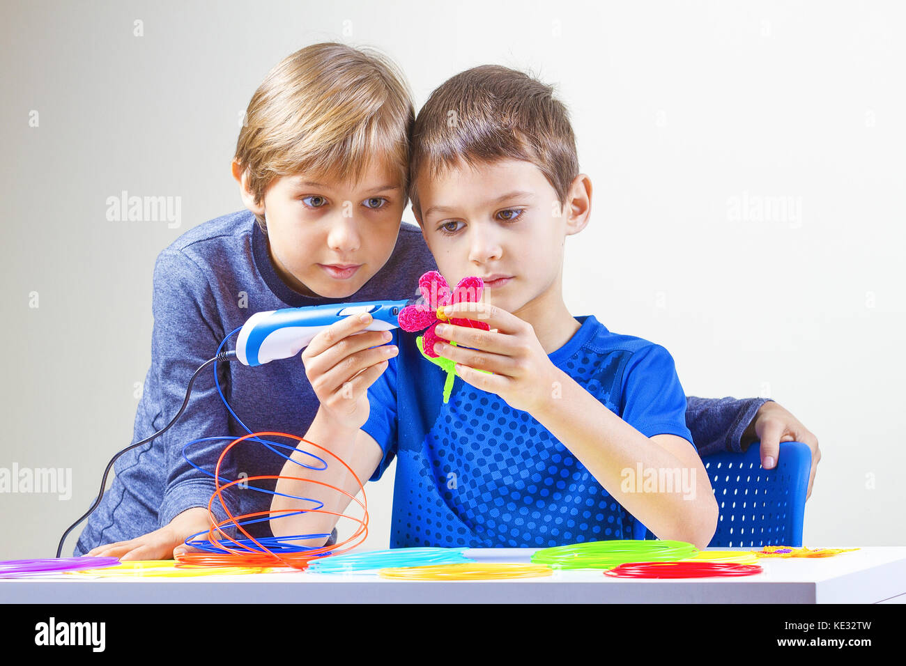 Children creating with 3d printing pen Stock Photo - Alamy