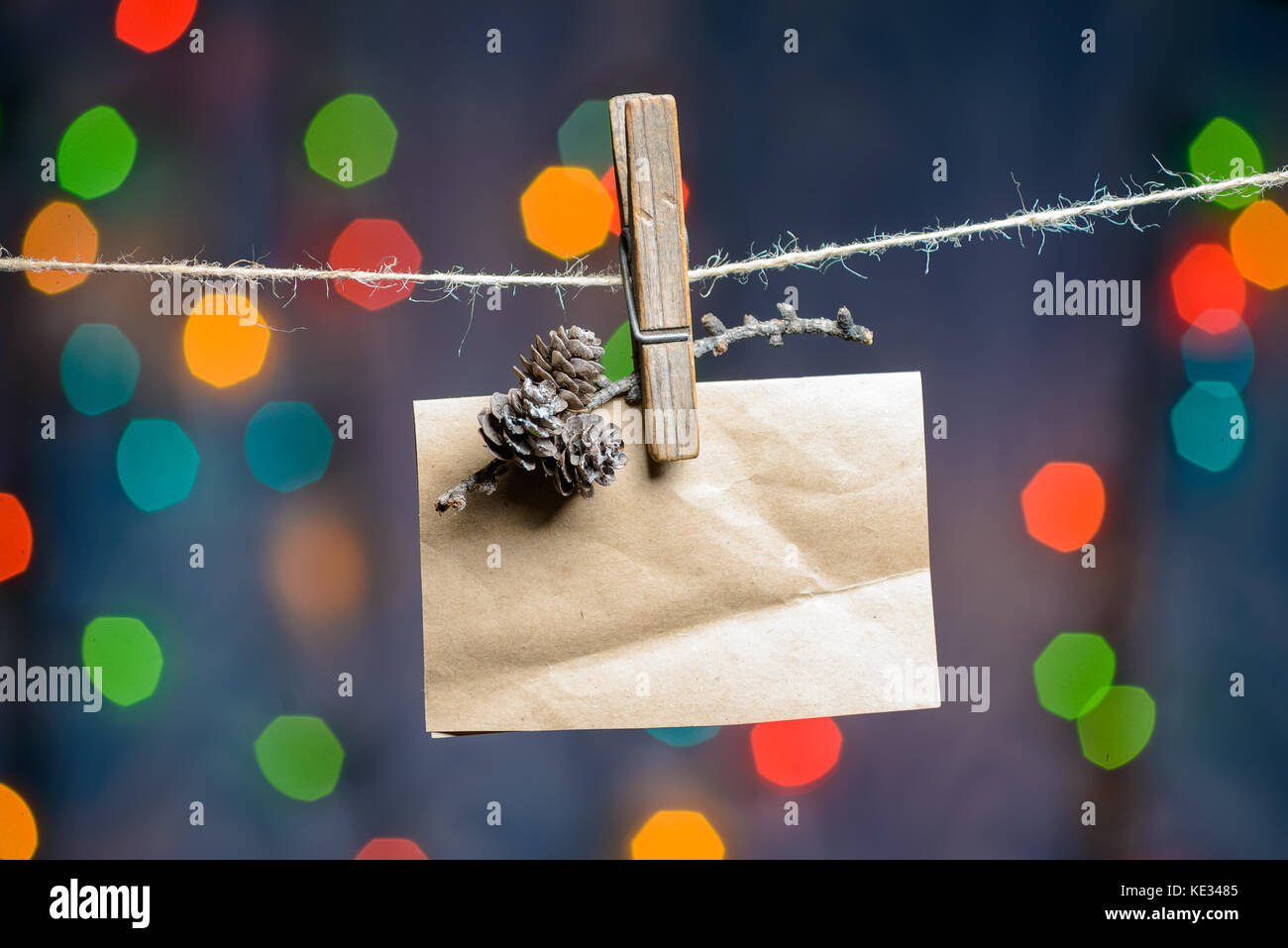 New Years greeting card hanging on rope with pin Stock Photo - Alamy