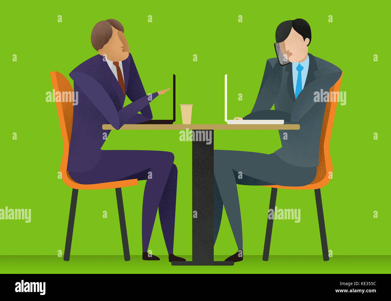 Two busy business coworkers at table Stock Photo - Alamy