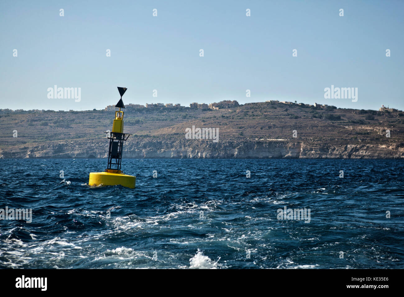 A reef hazard marker buoy off the coast of Comino in Malta Stock Photo ...