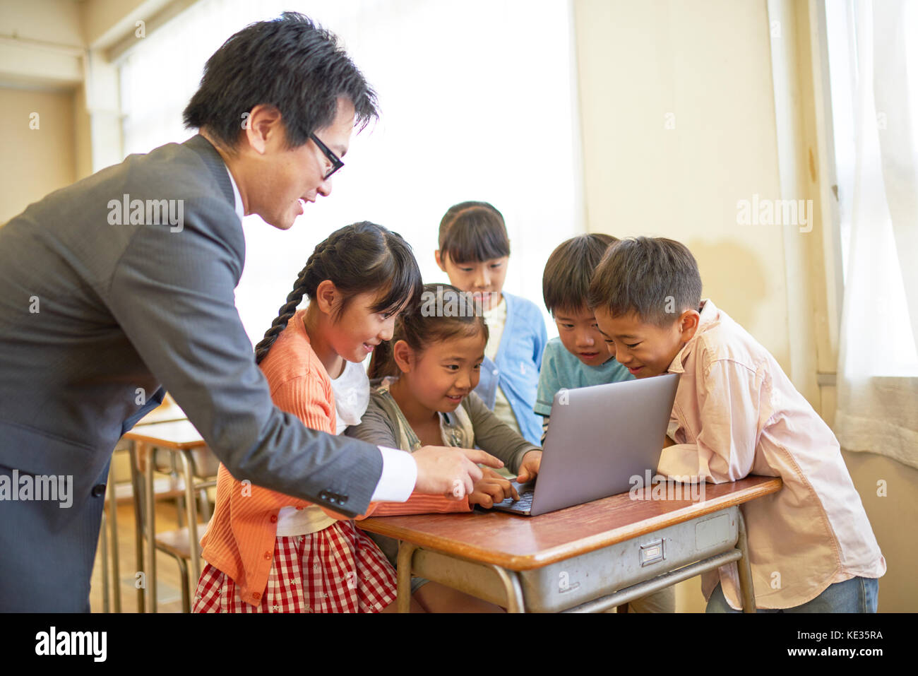 Japanese elementary school teacher teaching in the classroom Stock ...