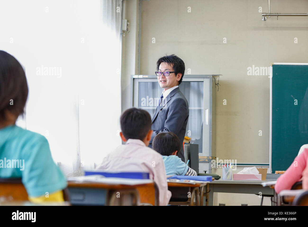 Japanese elementary school teacher teaching in the classroom Stock ...