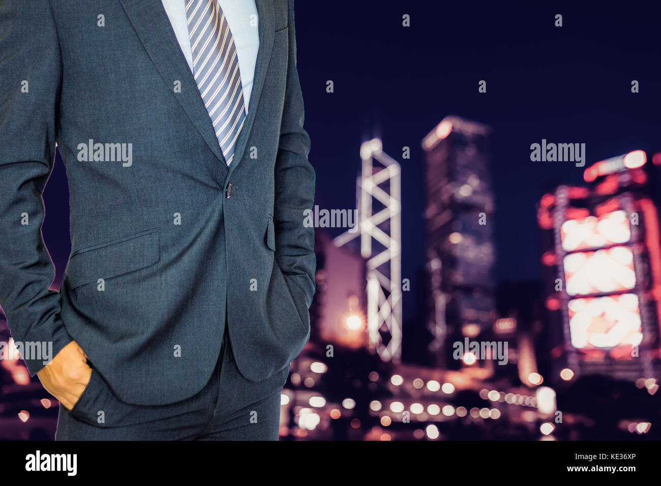 isolated business man on city light background Stock Photo - Alamy