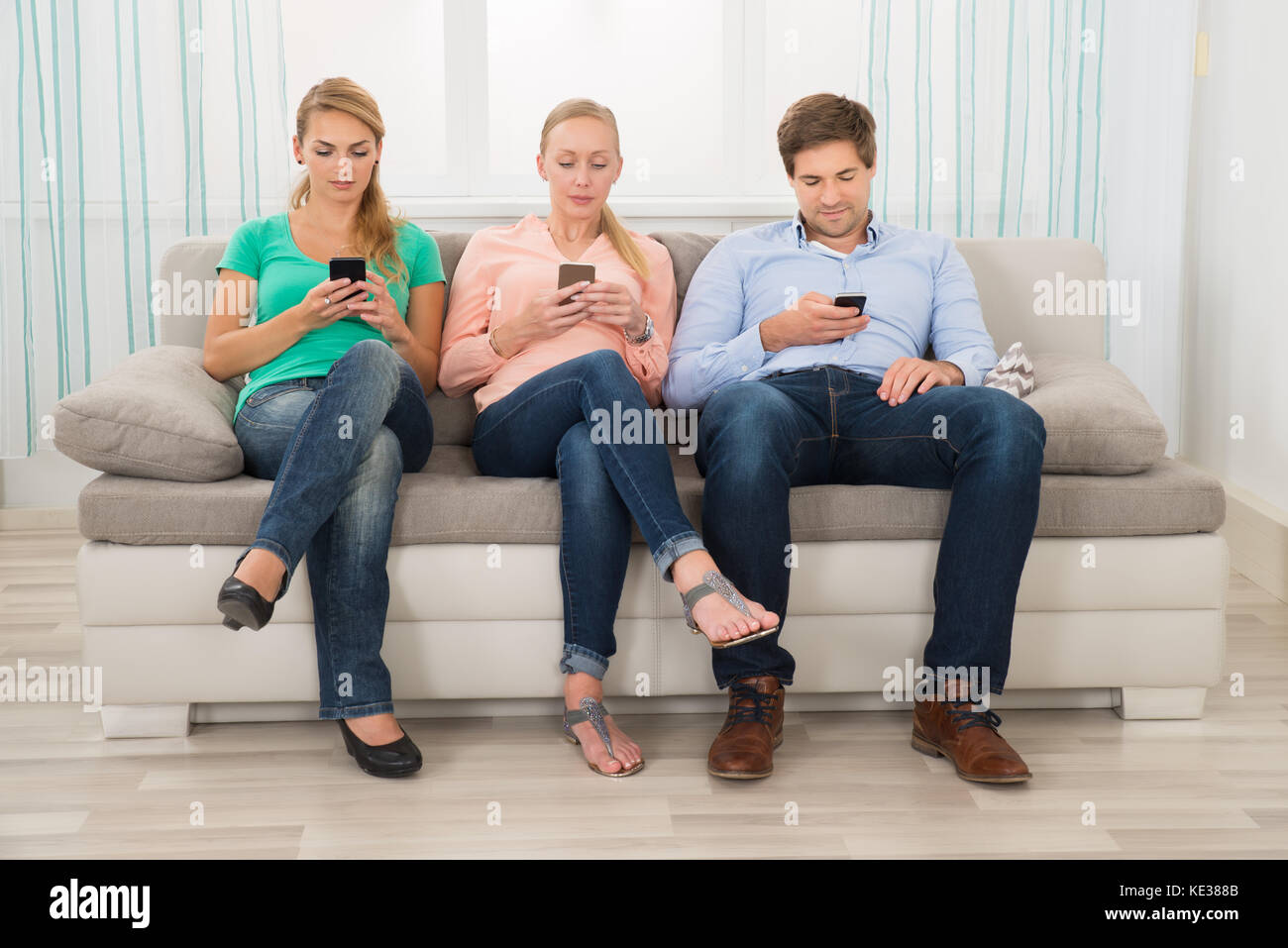 Group of people looking at mobile phones hi-res stock photography and ...