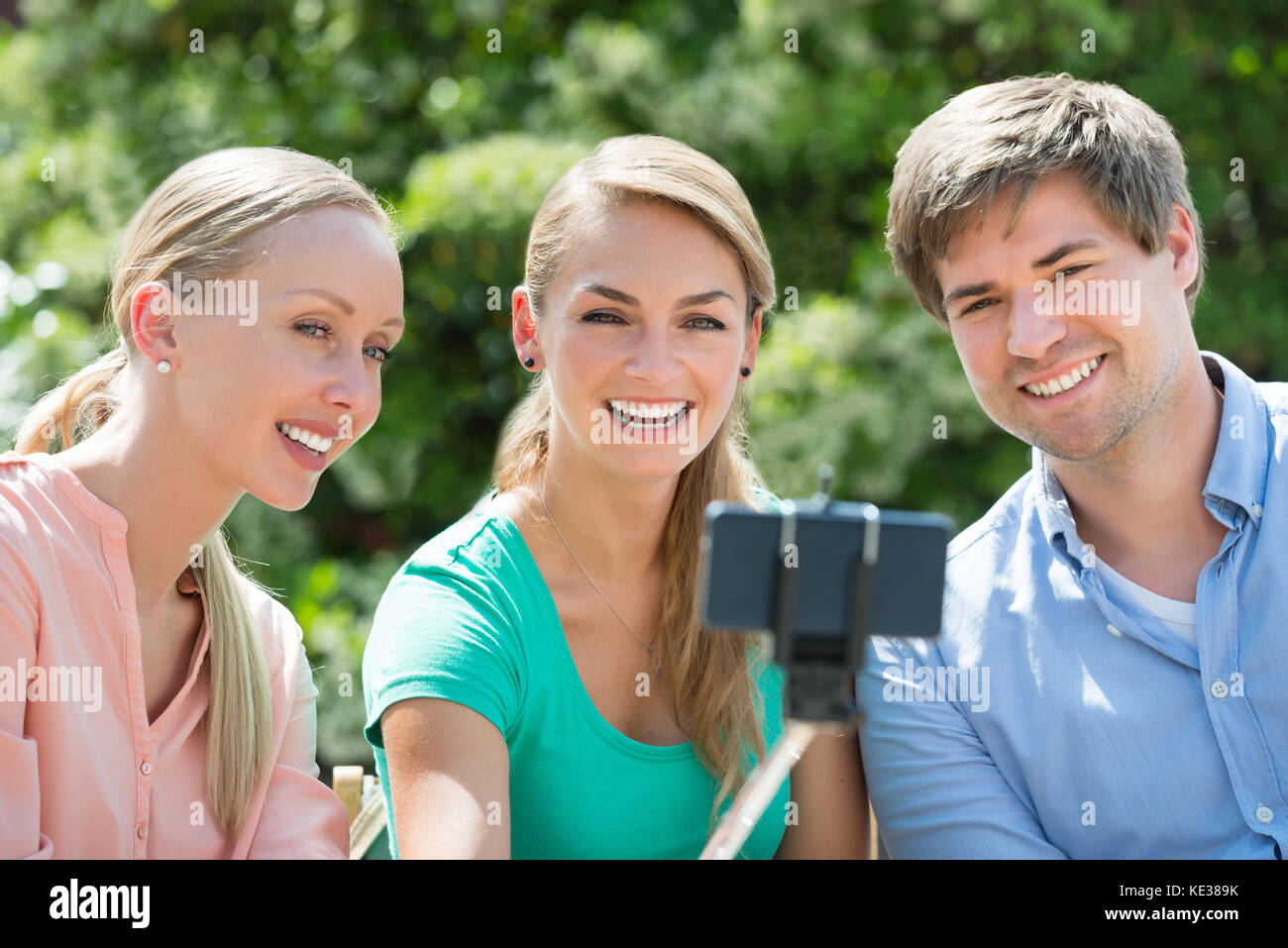 Man using selfie stick hi-res stock photography and images - Alamy