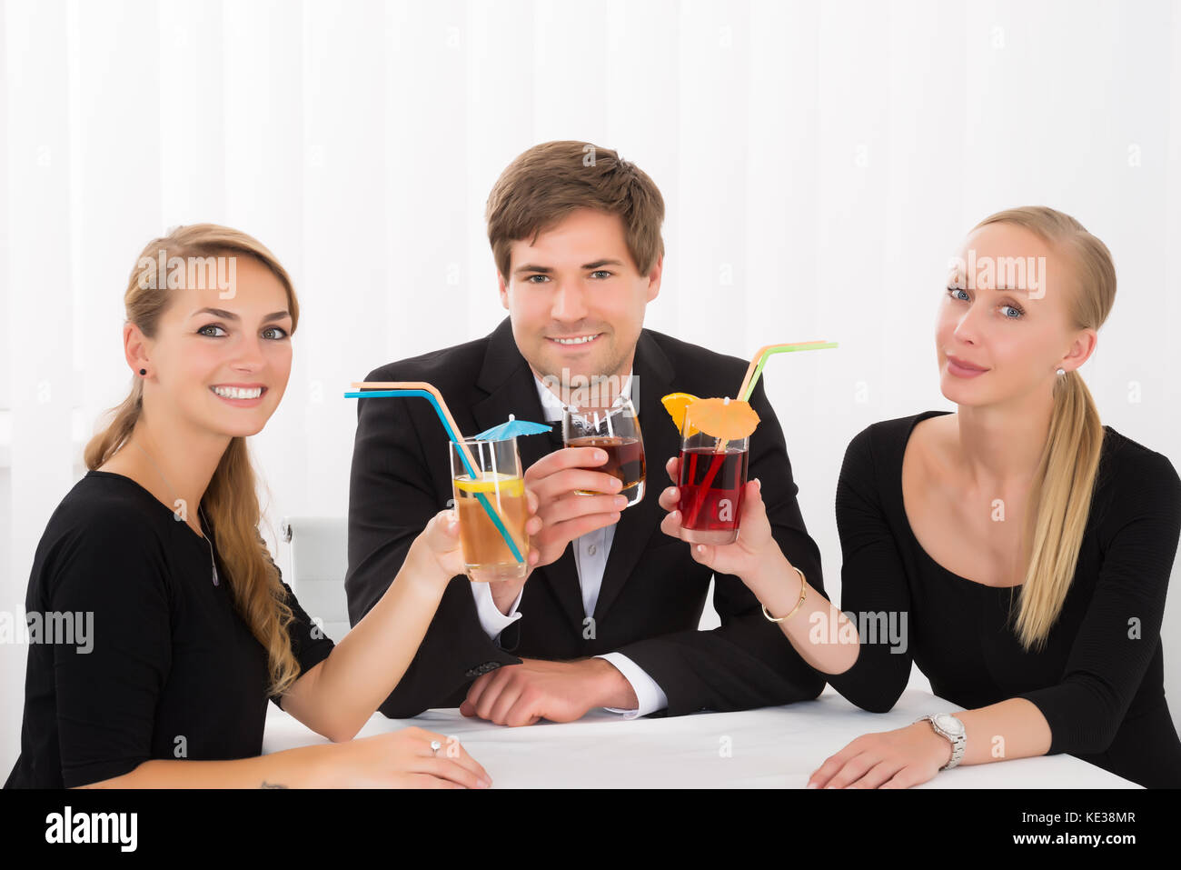 Young people cocktails indoors hi-res stock photography and images - Alamy