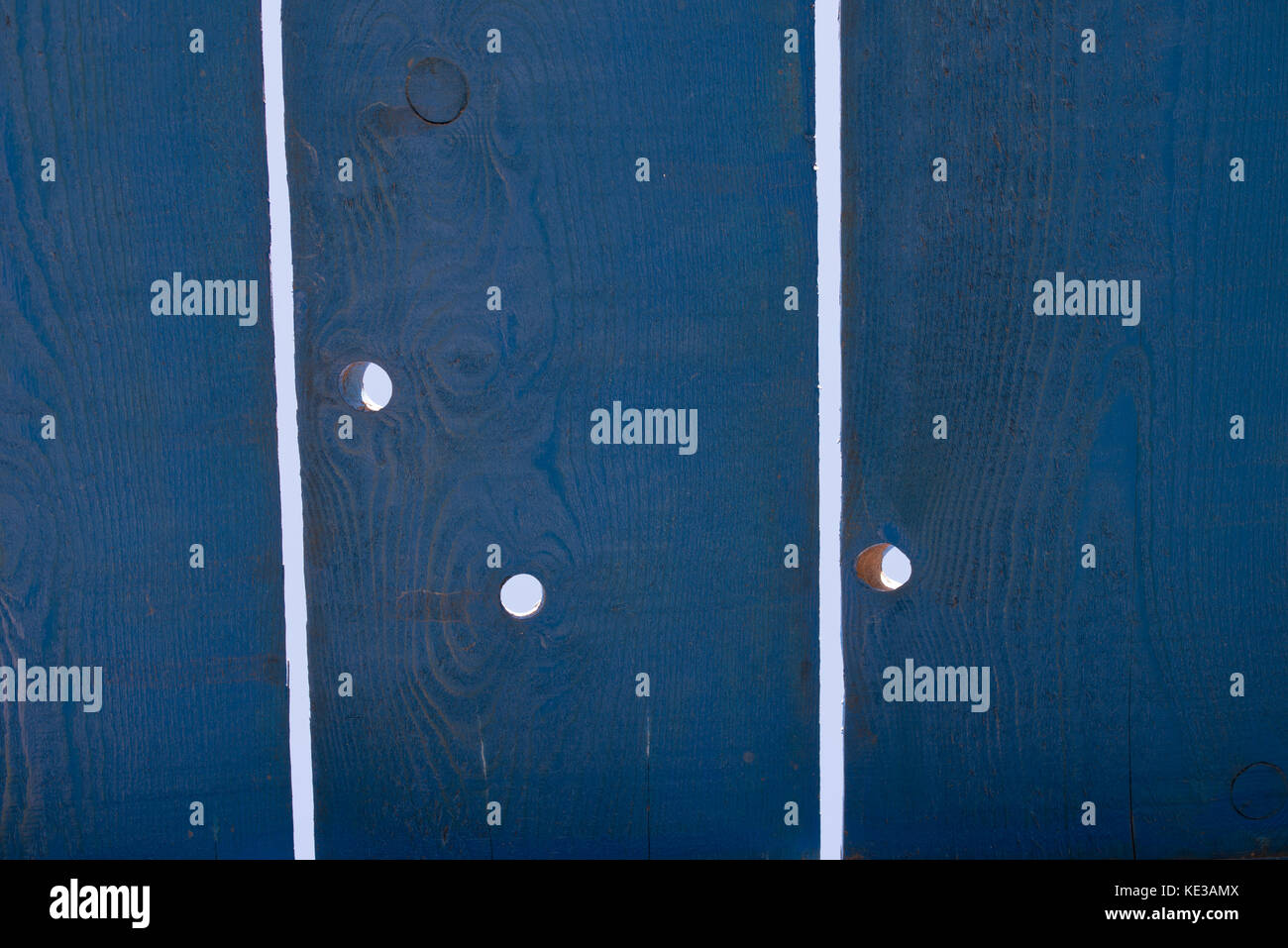 light holes through wooden dark blue planks Stock Photo - Alamy