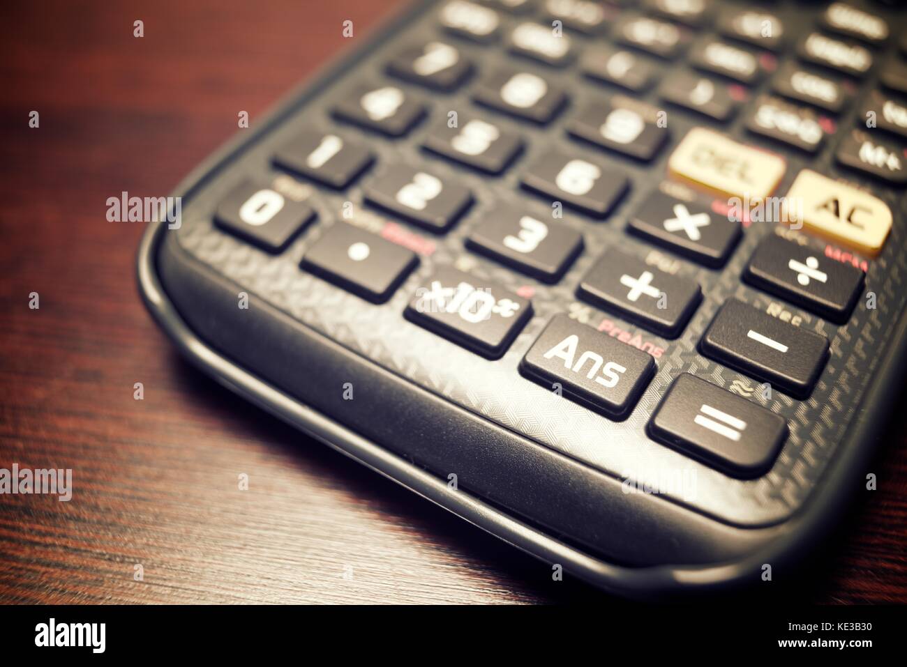 Scientific calculator close up on a wood table Stock Photo - Alamy