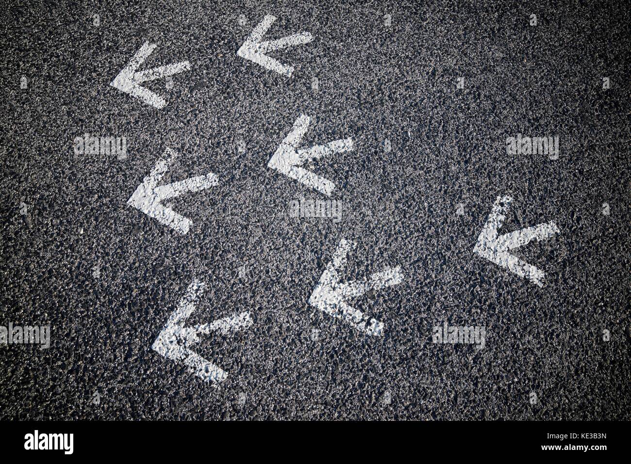 Directional arrows painted on a cement floor Stock Photo - Alamy