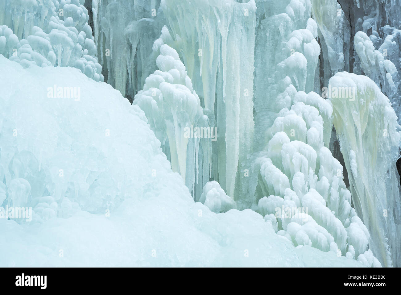 Close up of ice formations from a frozen waterfalls in winter in Creek ...