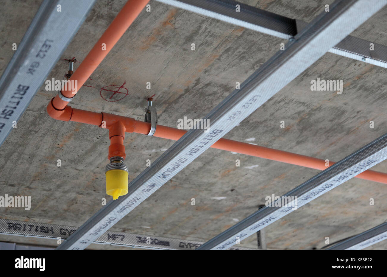 Newly installed fire sprinker system shown during the construction of a ...