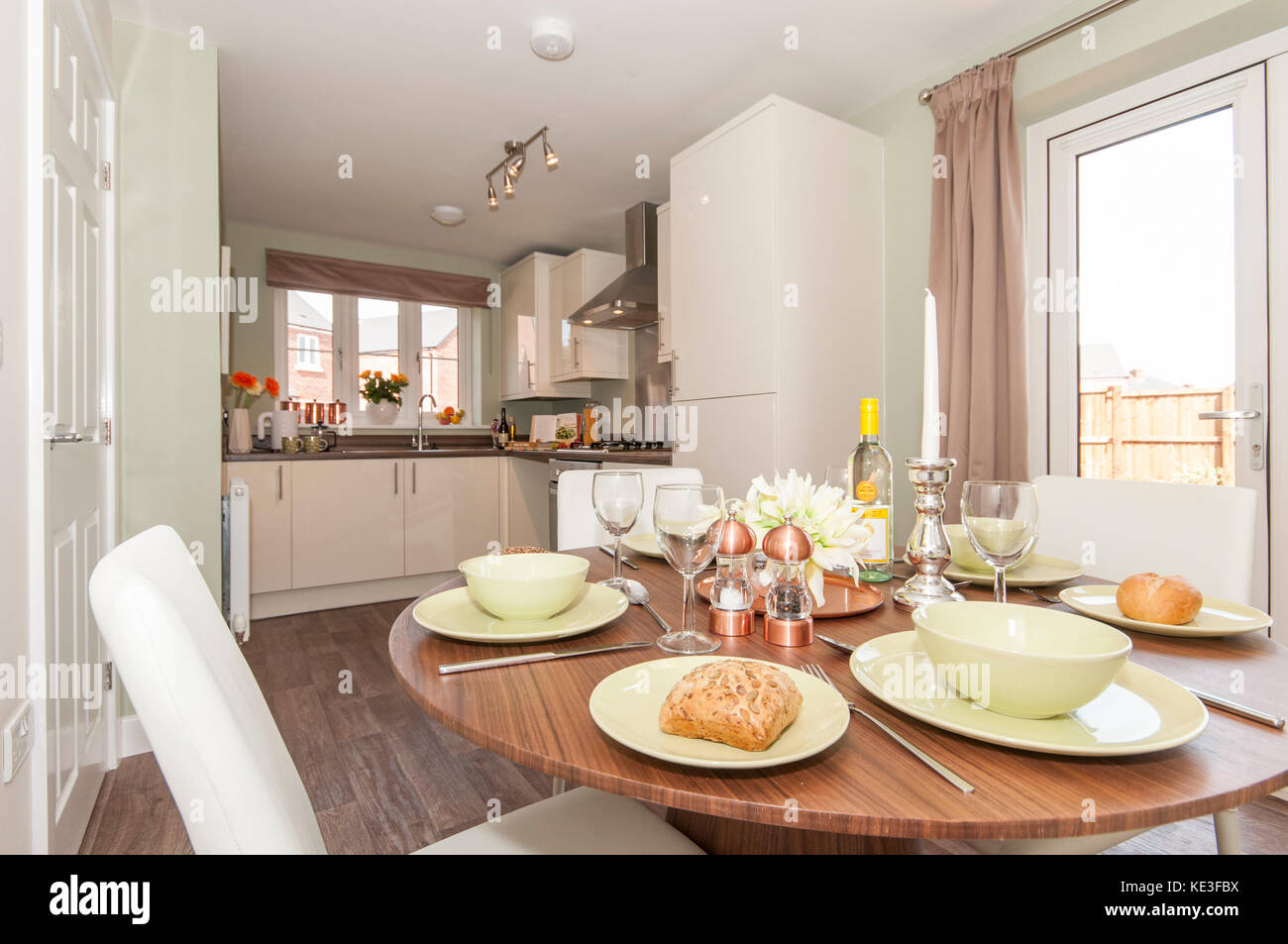 Dining table in family kitchen Stock Photo - Alamy