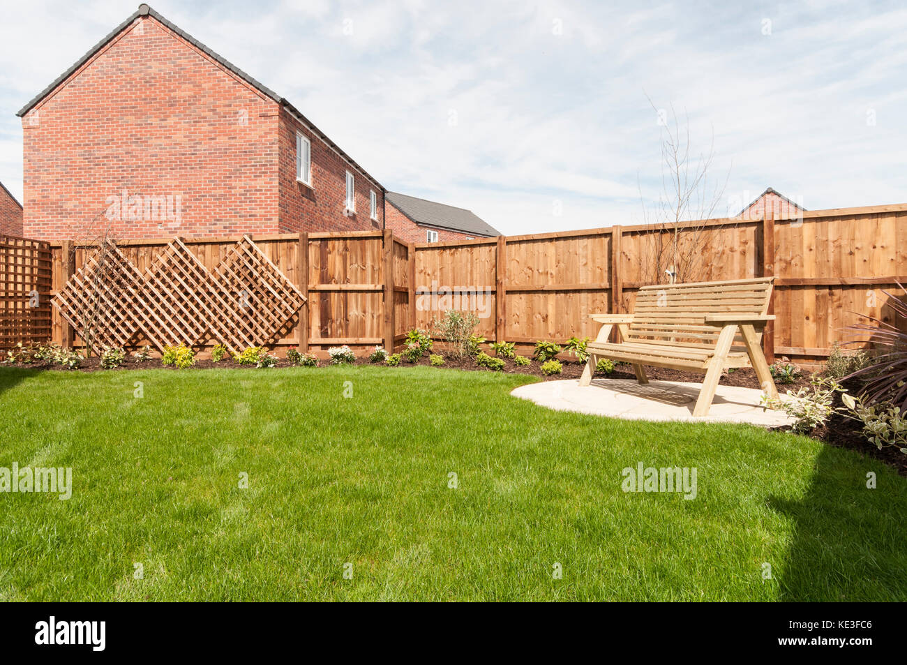 Back garden of show house, new build home Stock Photo - Alamy