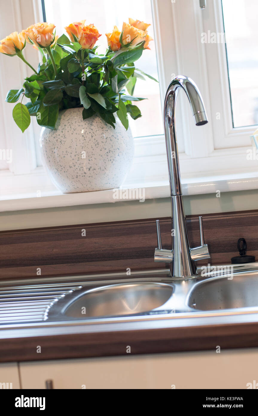 Curved kitchen mixer tap Stock Photo - Alamy