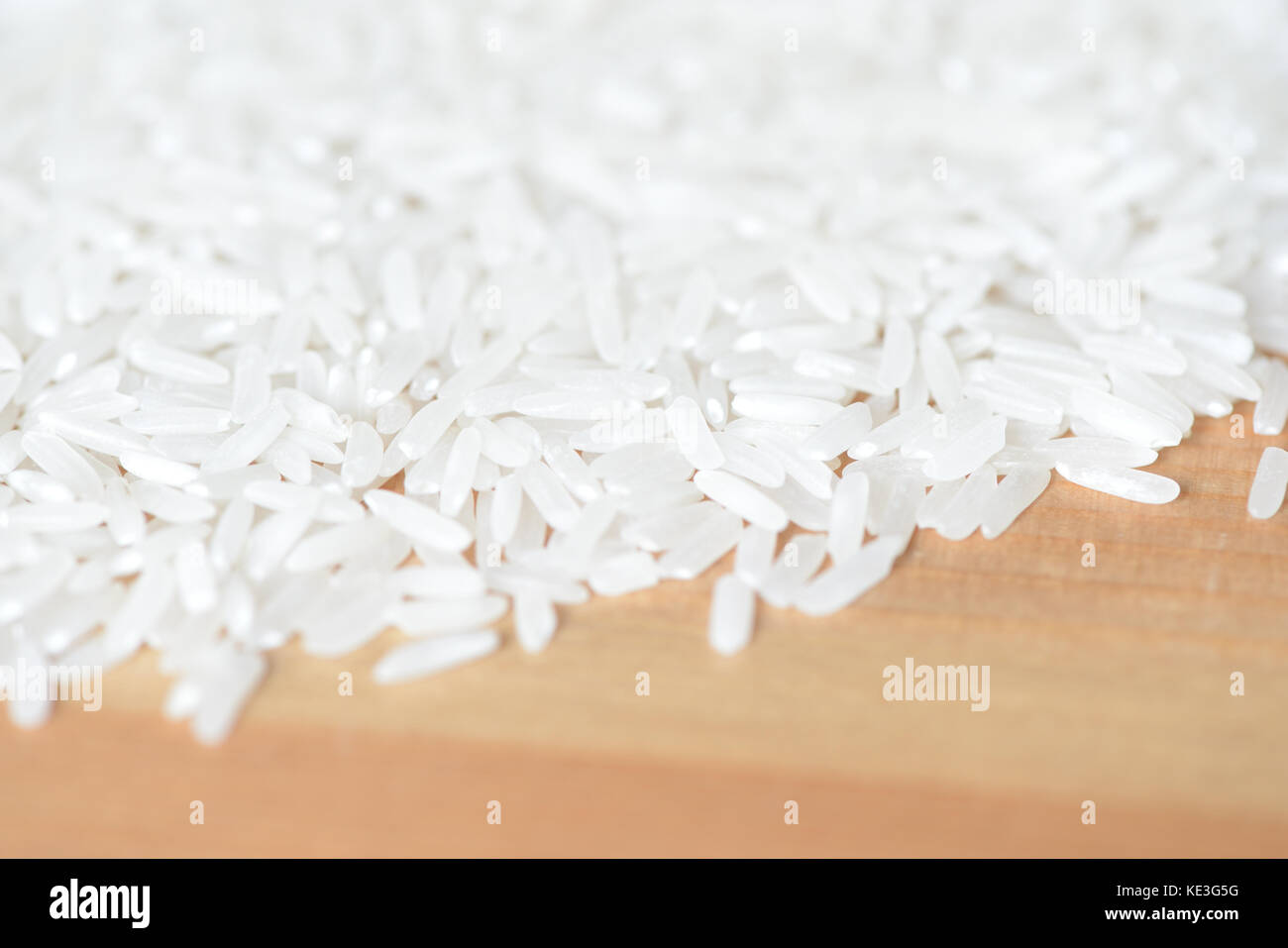 Scattered rice grains on the wooden surface Stock Photo - Alamy