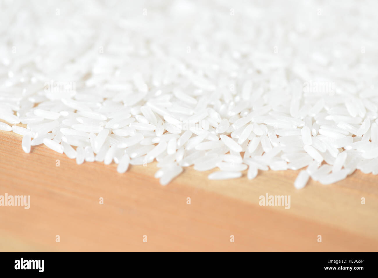 Scattered rice grains on the wooden surface Stock Photo - Alamy