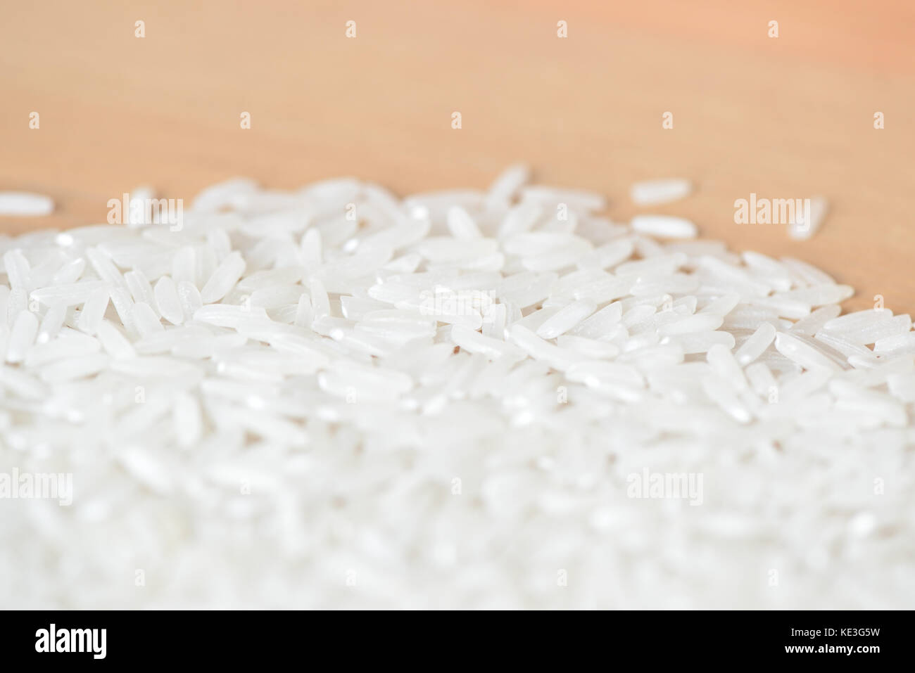 Scattered rice grains on the wooden surface Stock Photo - Alamy