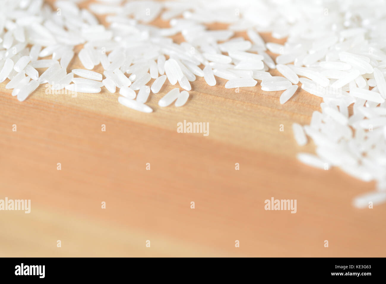 Scattered rice grains on the wooden surface Stock Photo - Alamy