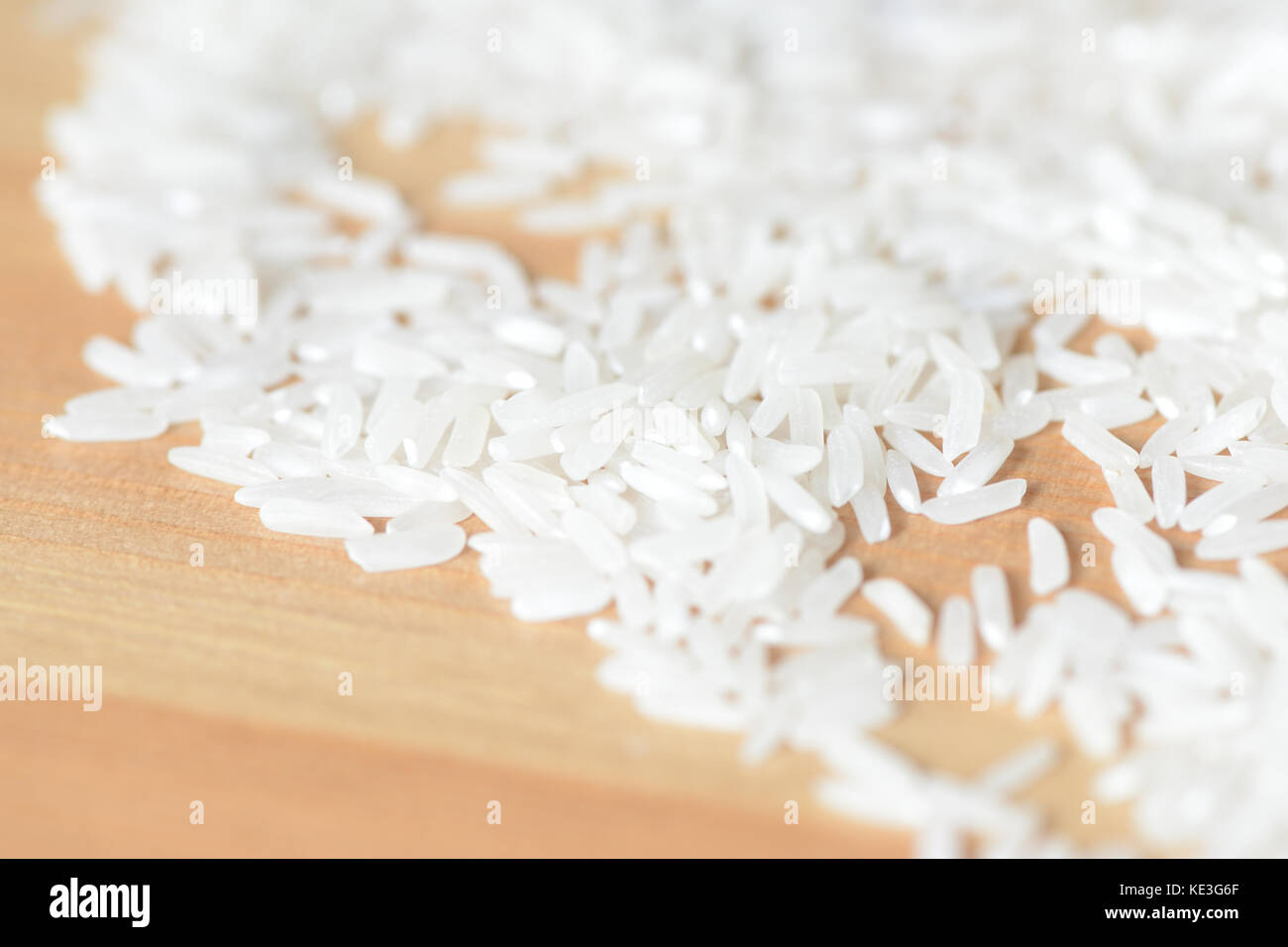 Scattered rice grains on the wooden surface Stock Photo - Alamy