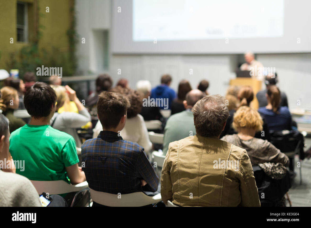 Man giving presentation in lecture hall at university Stock Photo - Alamy