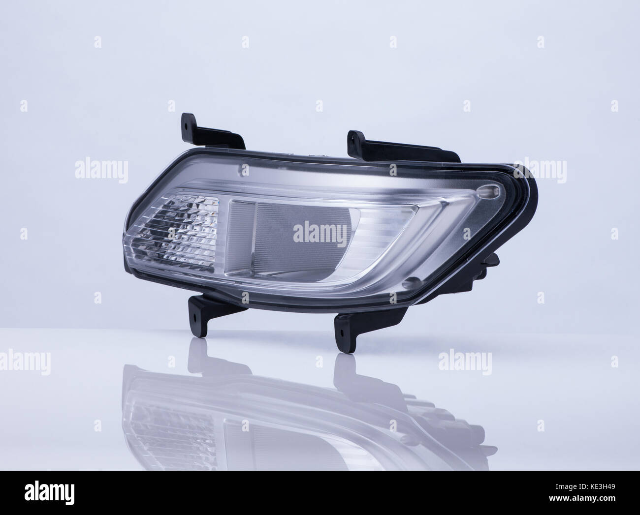 car headlight on bright background with reflection. isolated Stock ...