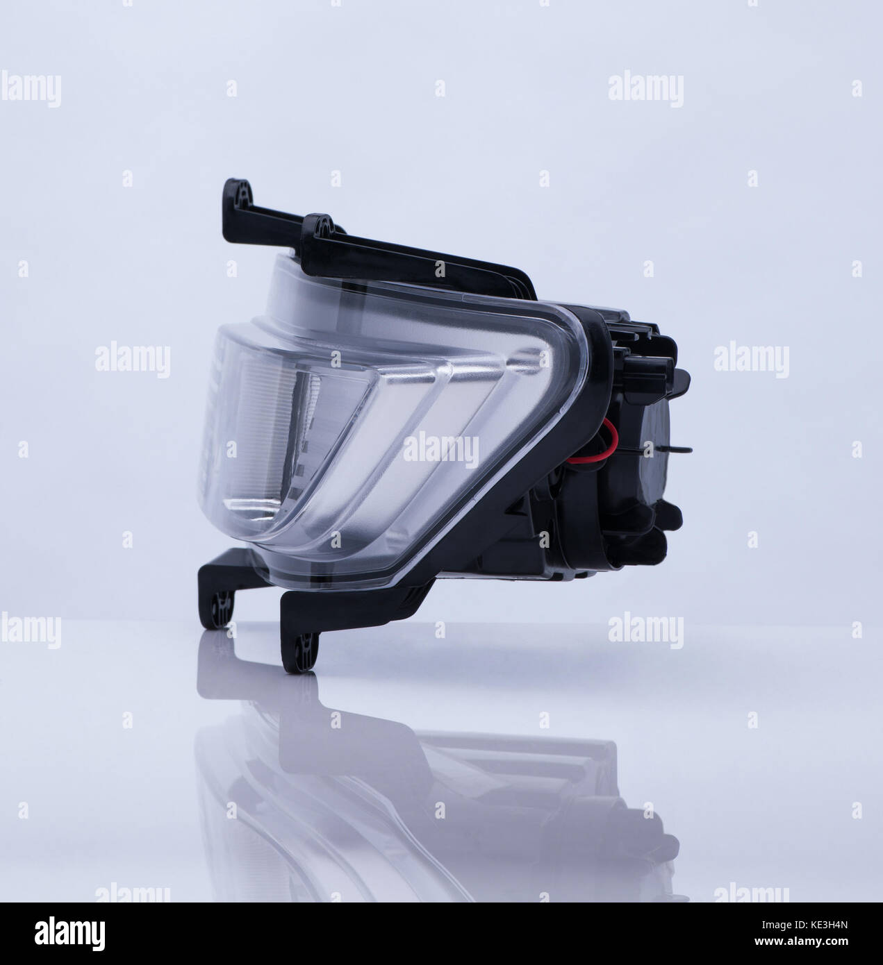 car light on bright background with reflection. isolated Stock Photo ...