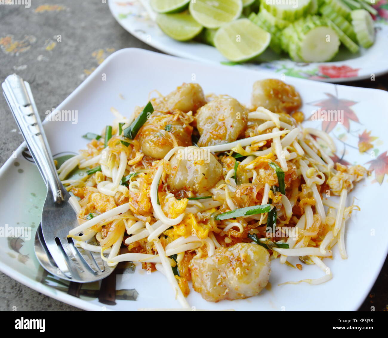 Pad Thai stir fried rice noodle with fish dumpling and egg on dish ...
