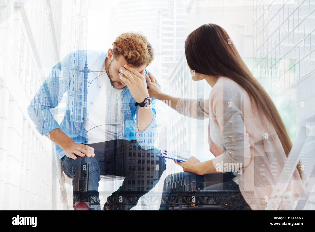 Professional psychologist calming the patient down Stock Photo - Alamy