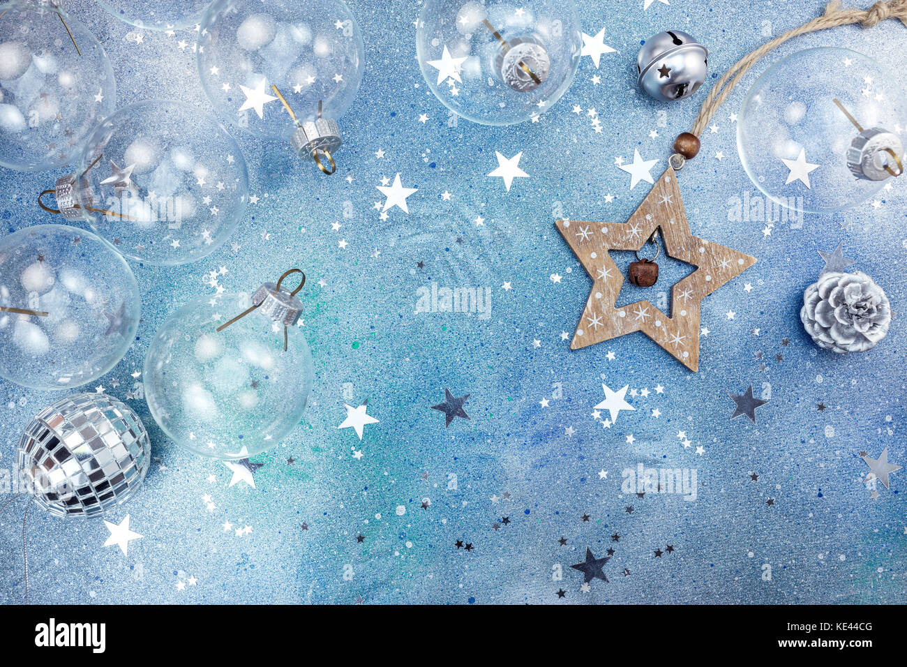 decorative wooden star and glass christmas balls on starry blue ...