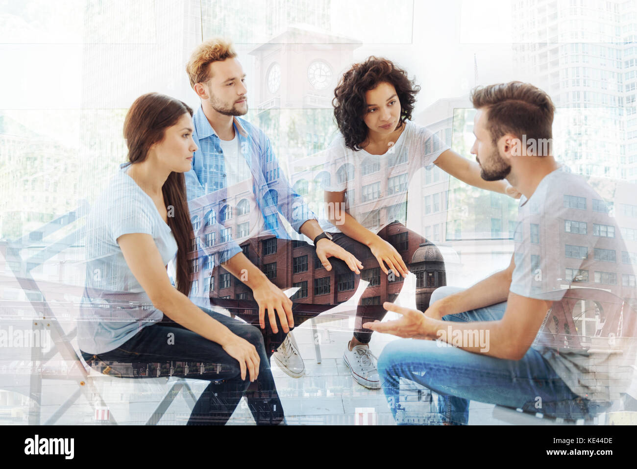Careful colleagues supporting their friend Stock Photo - Alamy