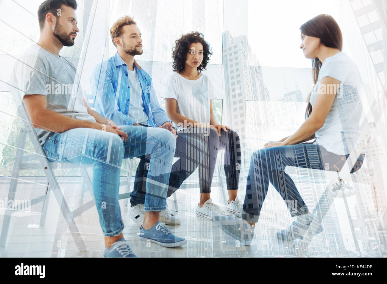 Disappointed colleagues talking with psychologist Stock Photo - Alamy