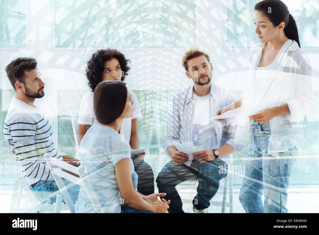Experienced psychologist talking with clients Stock Photo - Alamy