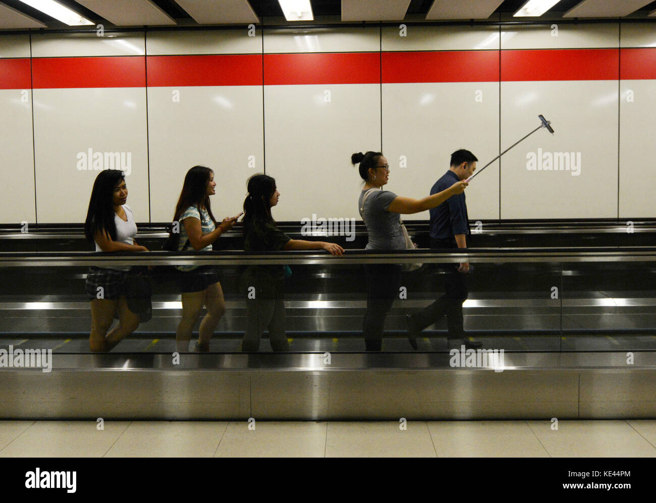 Group Selfie on the travelator ( moving walkway ) in Hong Kong Stock ...