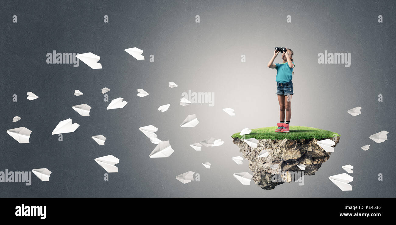 Concept of careless happy childhood with girl looking in binocul Stock ...