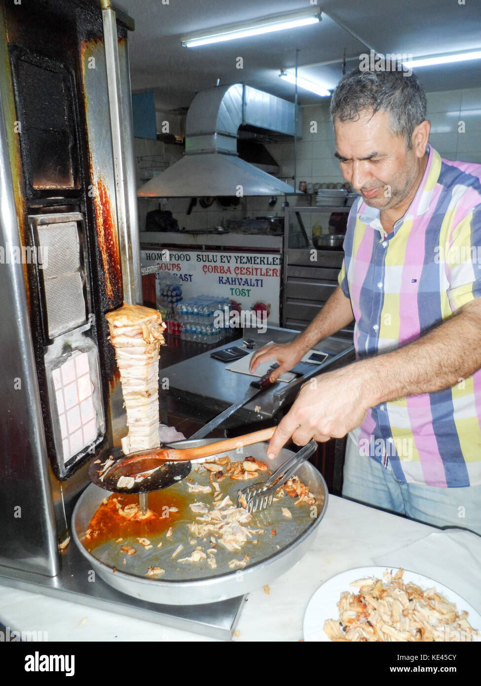 Chicken cooking in one of the many Turkish Kebab stall kitchens inside ...