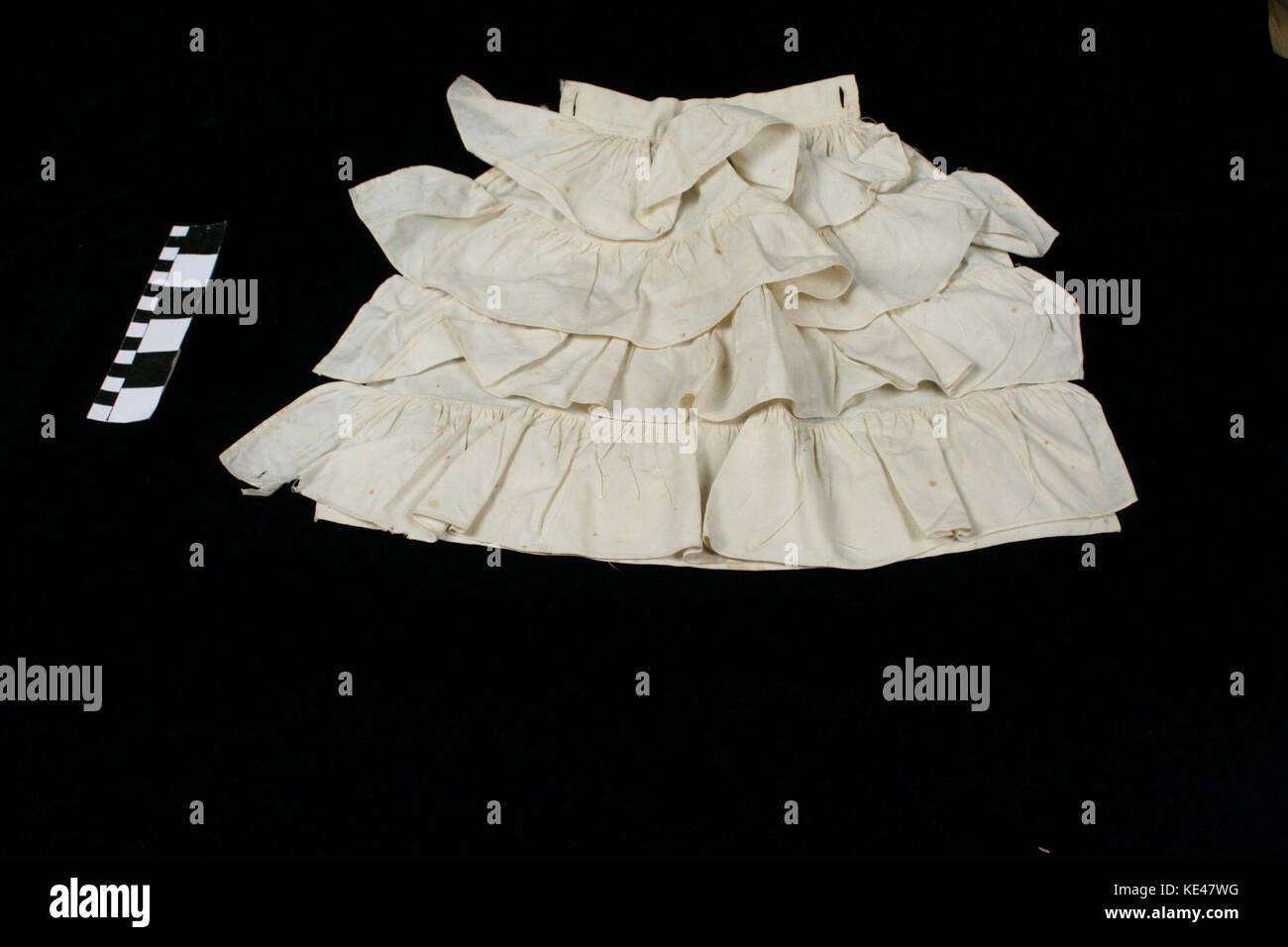 Woman's White Muslin Ruffled Bustle Stock Photo - Alamy