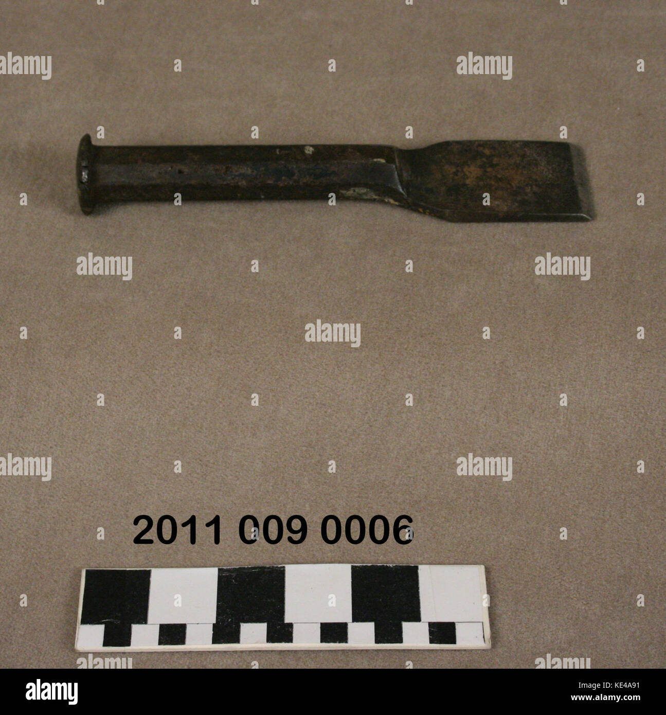 A steel chisel featuring an offset blade, designed for precision work ...