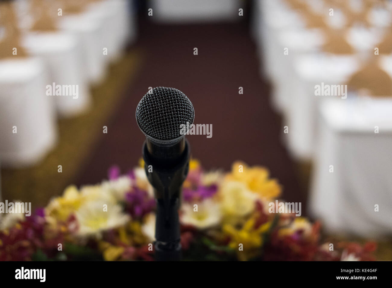 microphone in modern conference hall interior with white chairs ...