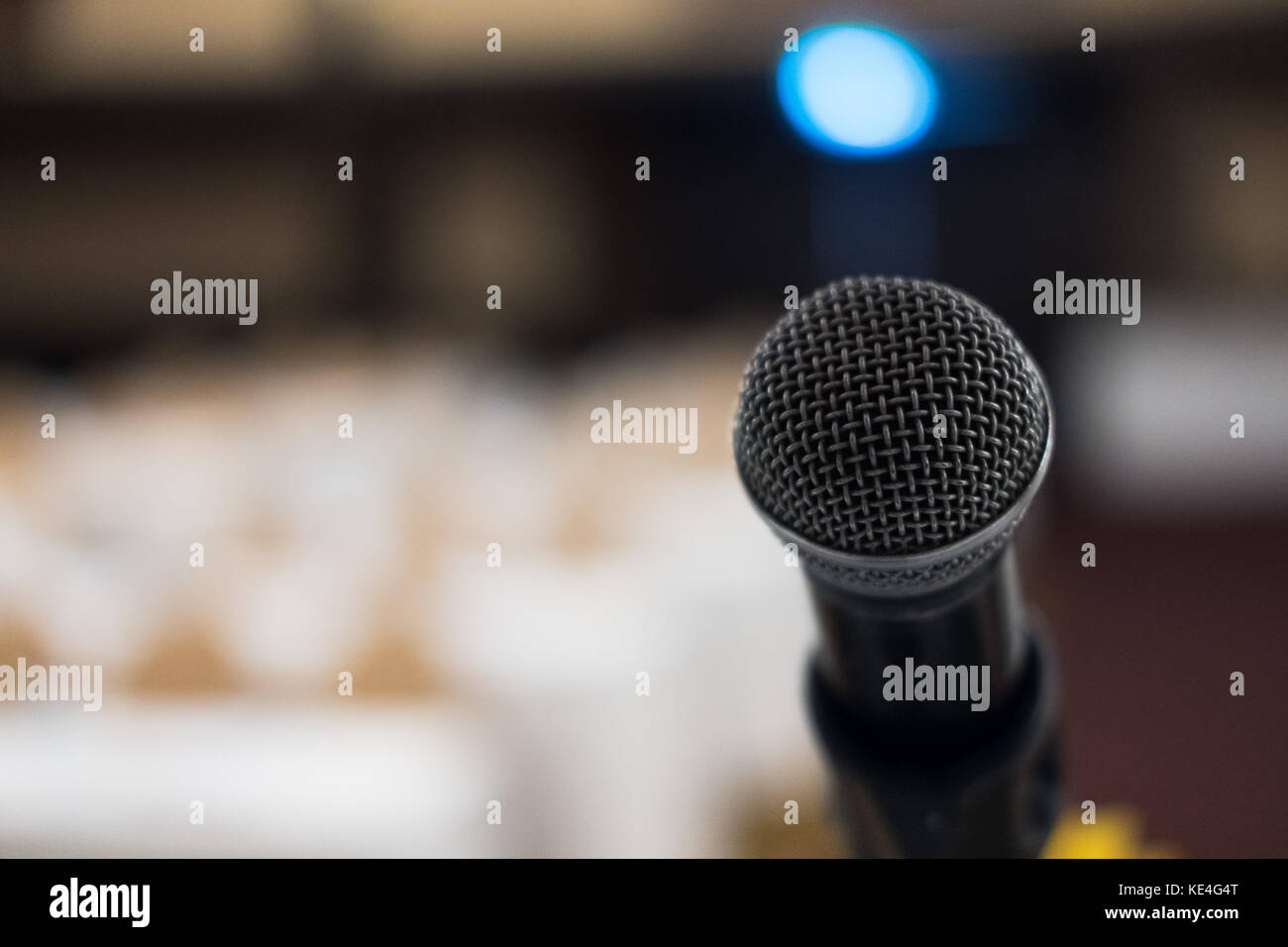 microphone in modern conference hall interior with white chairs ...
