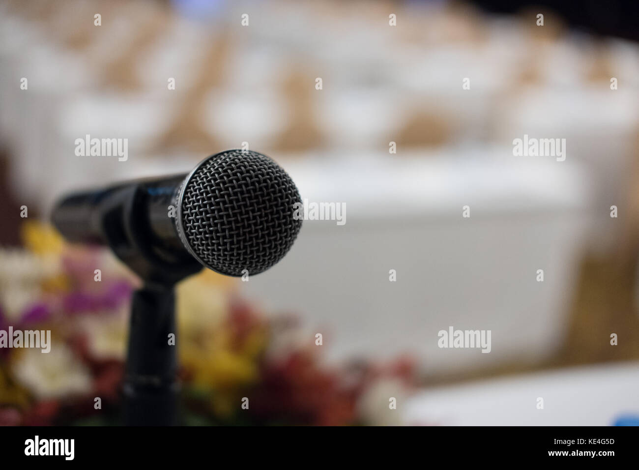 microphone in modern conference hall interior with white chairs ...